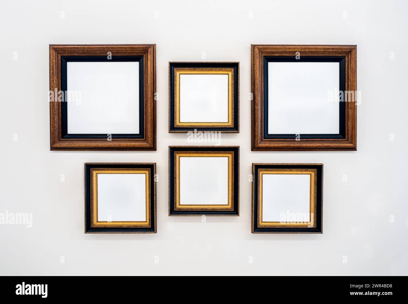 Mockup group of white blank spaces on six square painting art frames ...