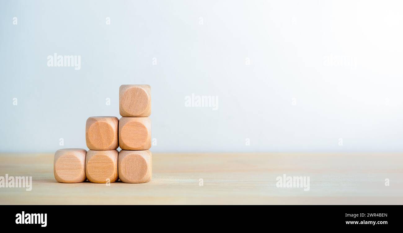 Clean wooden cube blocks stack as business chart steps isolated on wood ...