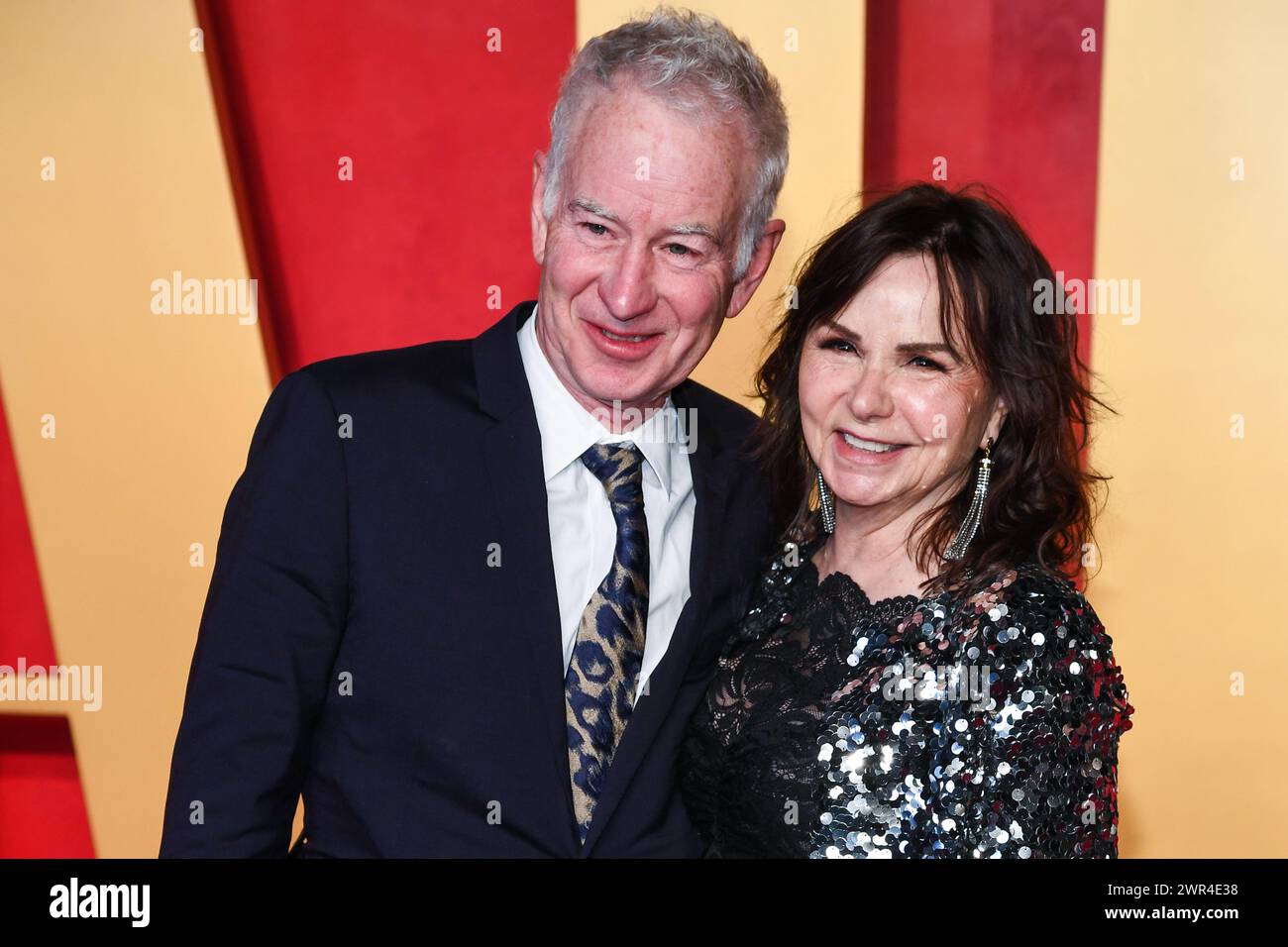 USA. 10th Mar, 2024. John McEnroe and Patty Smyth walking on the red ...