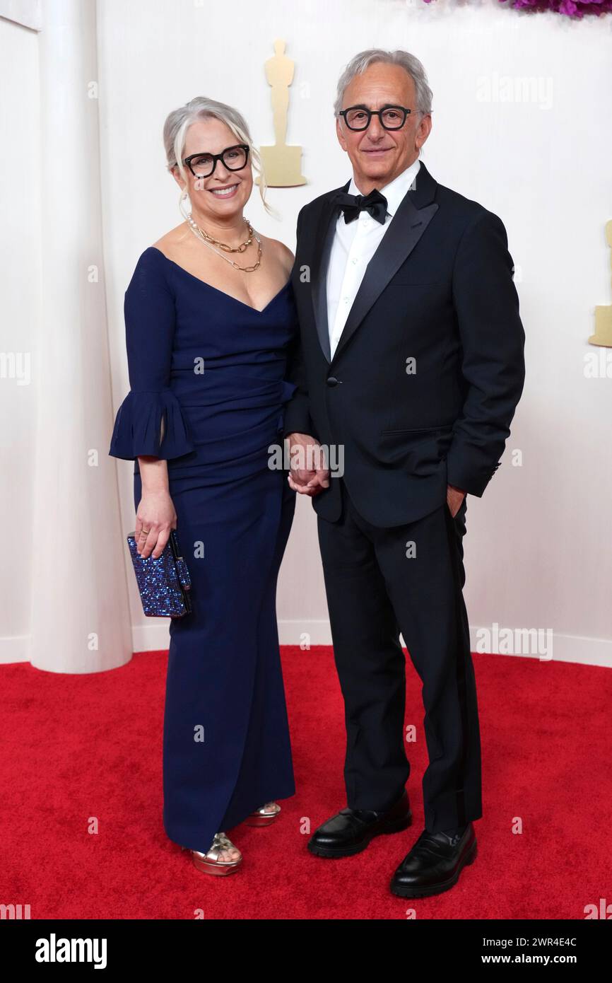 Fred Berner, right, arrives at the Oscars on Sunday, March 10, 2024, at ...
