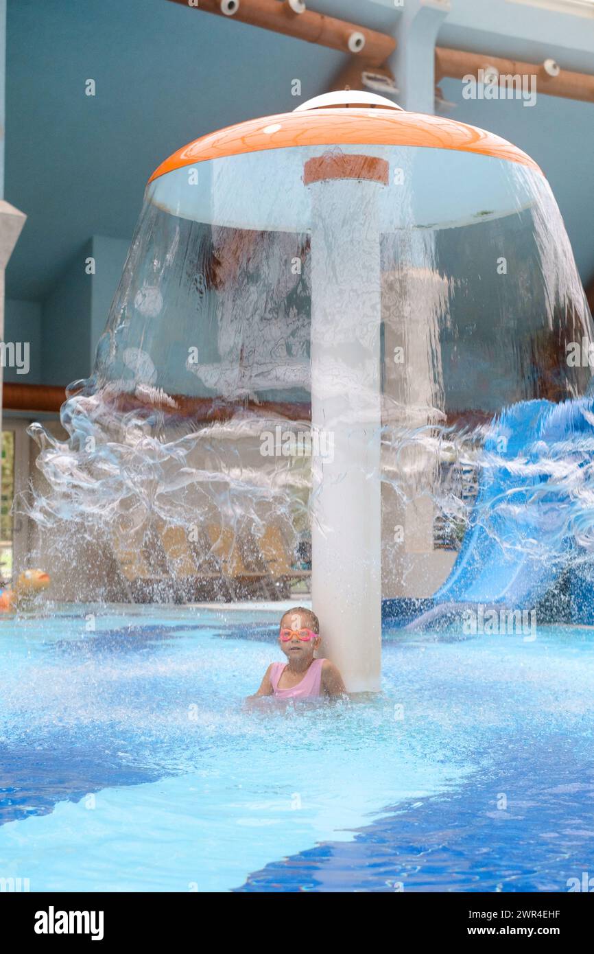 Water fountain in aquapark. Mushroom shape fountain in indoor adventure ...