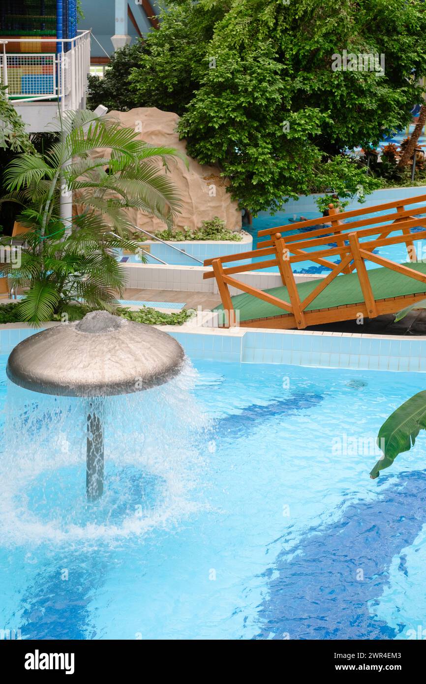 Water fountain in aquapark. Mushroom shape fountain in indoor adventure ...