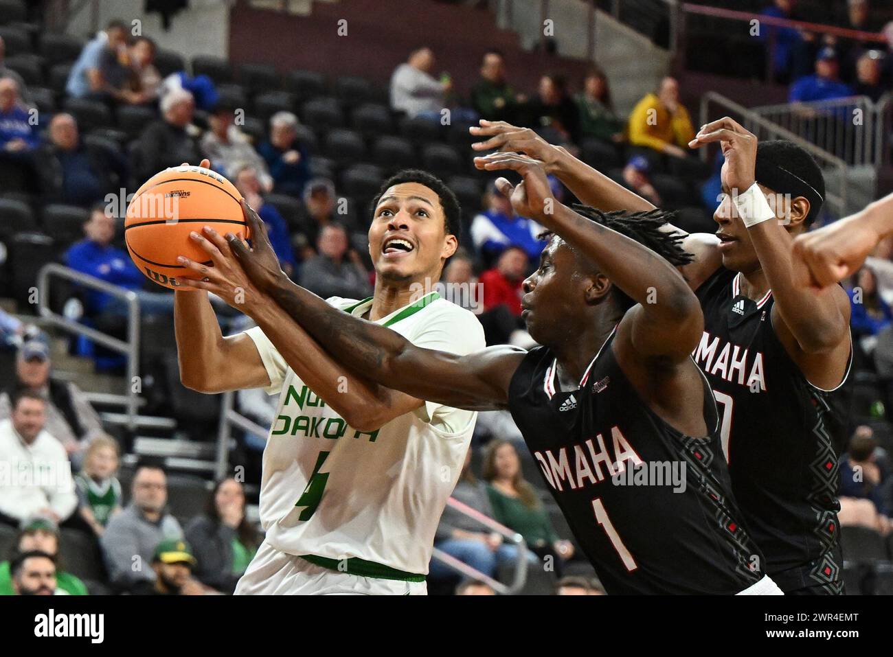 North Dakota Fighting Hawks guard Tyree Ihenacho (4) is fouled by ...