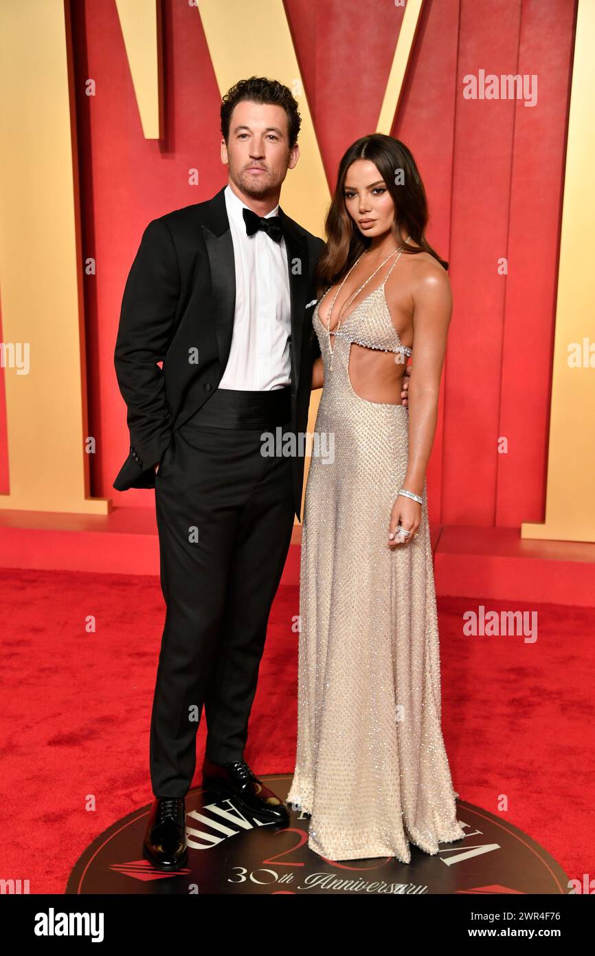 Miles Teller, left, and Keleigh Sperry arrive at the Vanity Fair Oscar ...