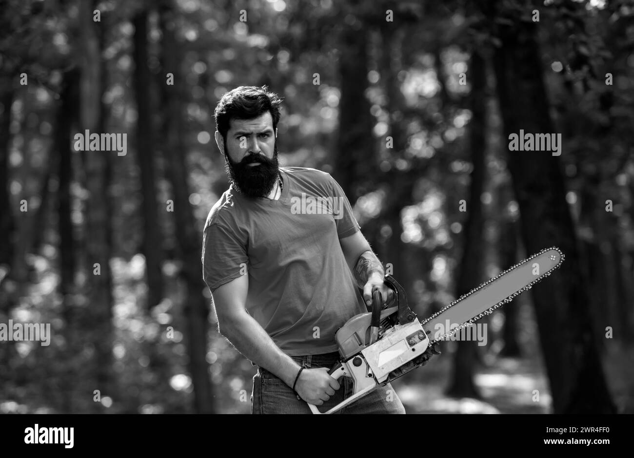 Portrait of a handsome man in forest Black and White Stock Photos ...