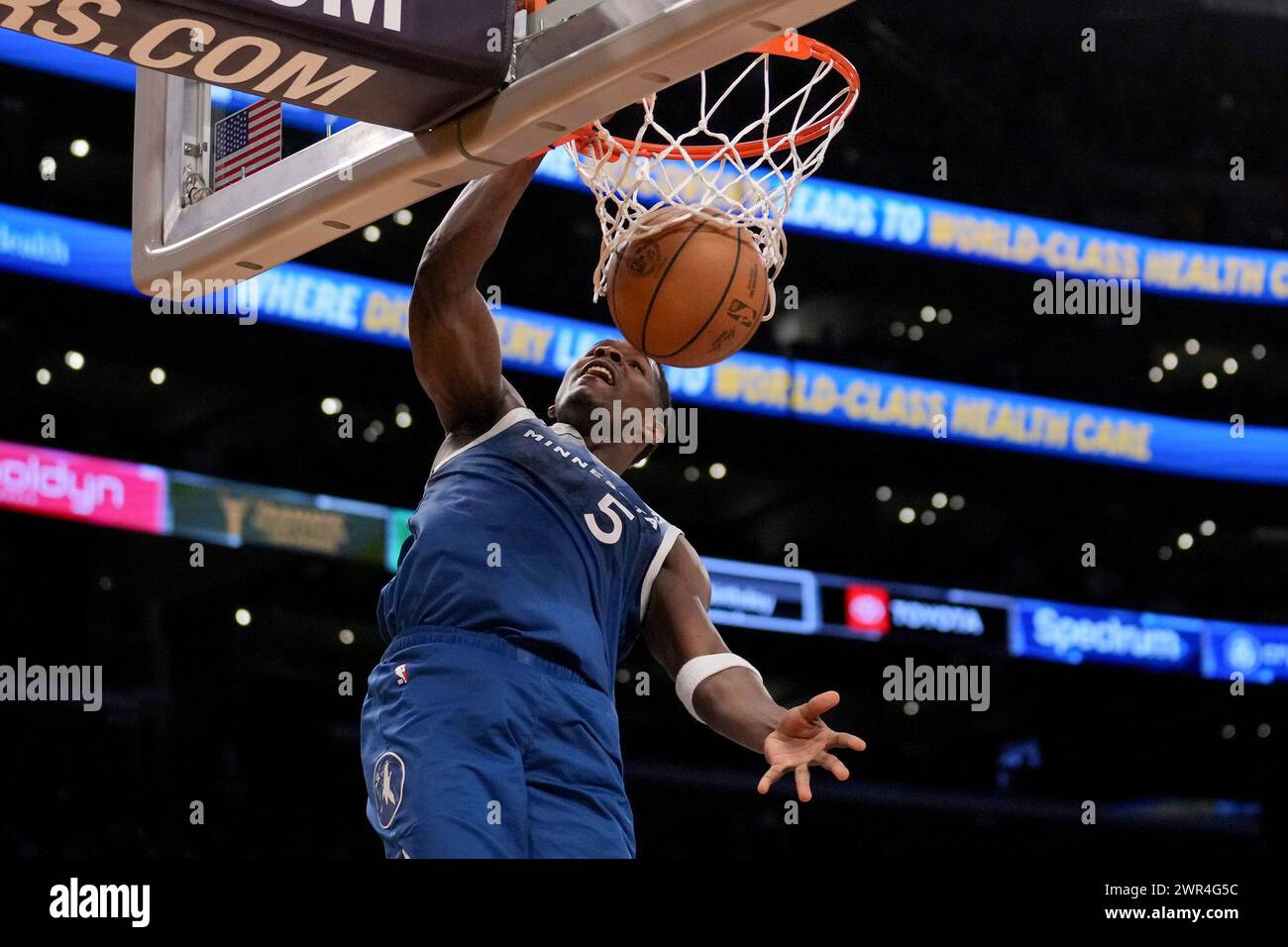 Minnesota Timberwolves guard Anthony Edwards (5) dunks during the ...