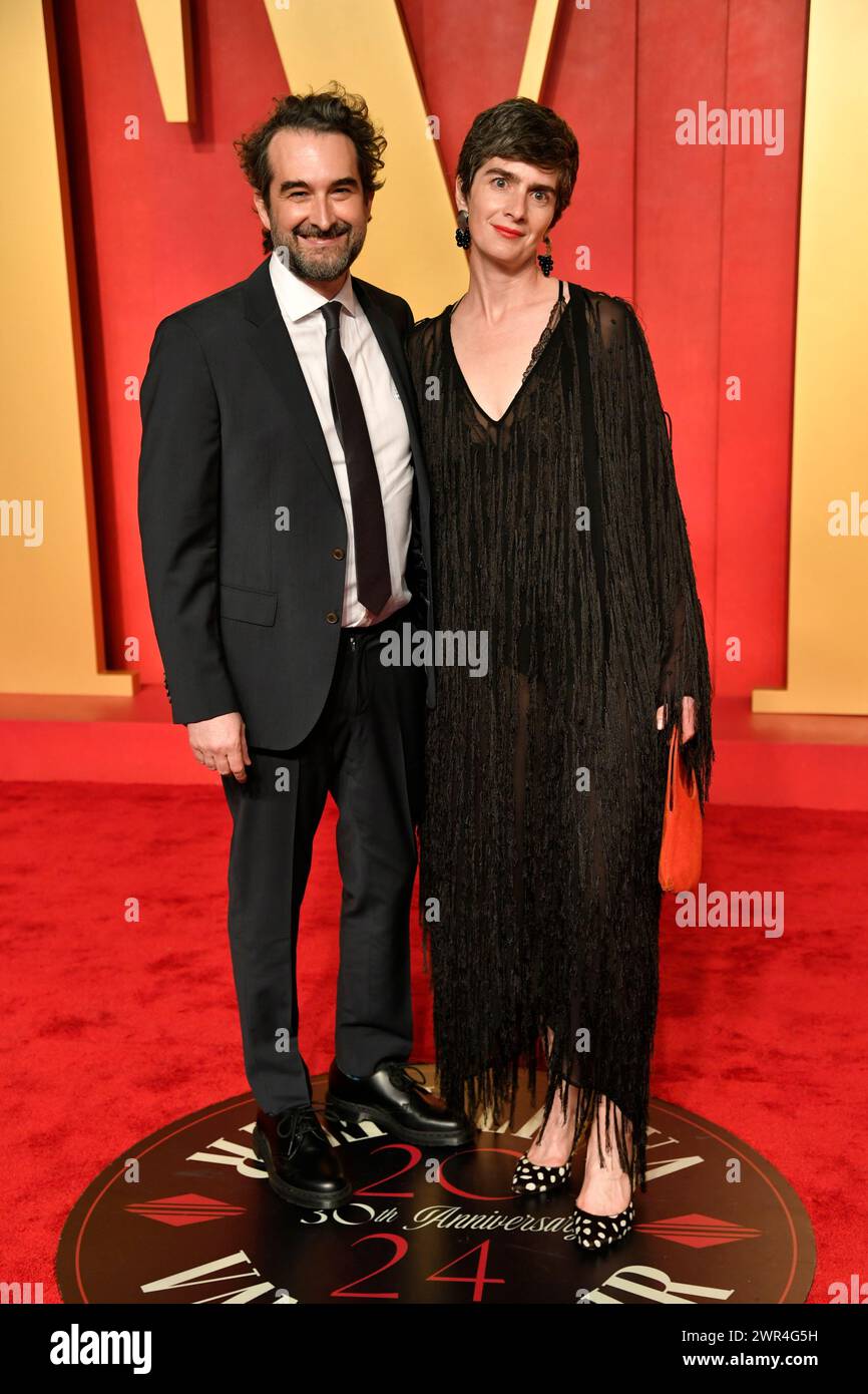 Jay Duplass, left, and Gaby Hoffmann arrive at the Vanity Fair Oscar ...
