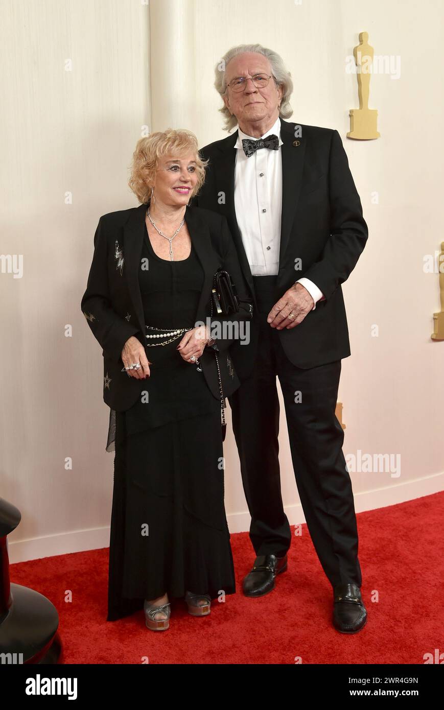 Mara Sklar, left, and Richard Edlund arrive at the Oscars on Sunday ...