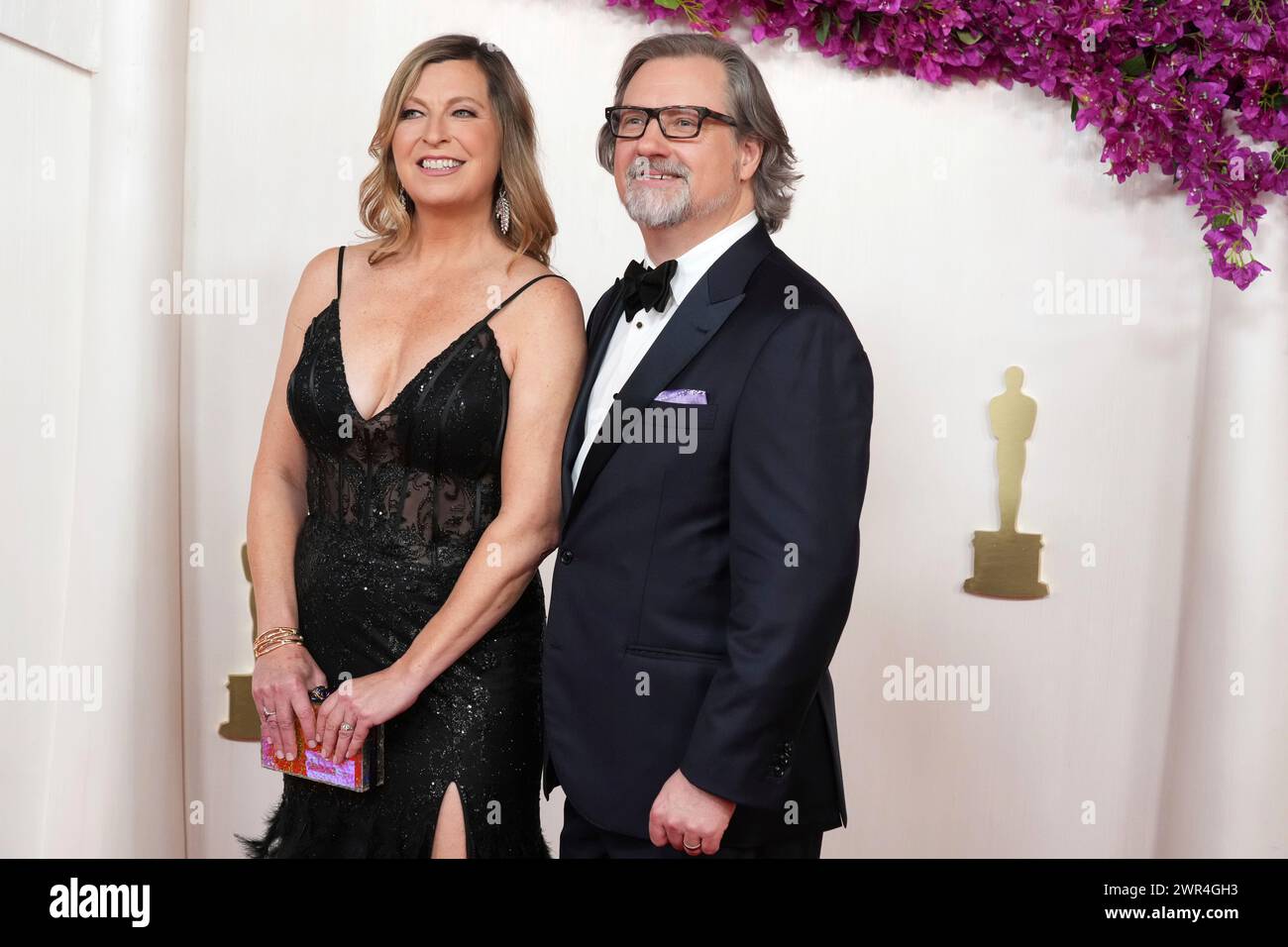 Lisa Mullins, left, and Dave Mullins arrive at the Oscars on Sunday ...