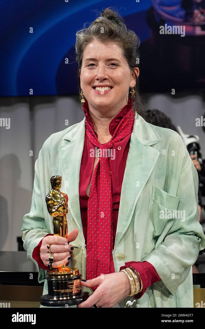 Shona Heath poses with the award for best production design for "Poor ...