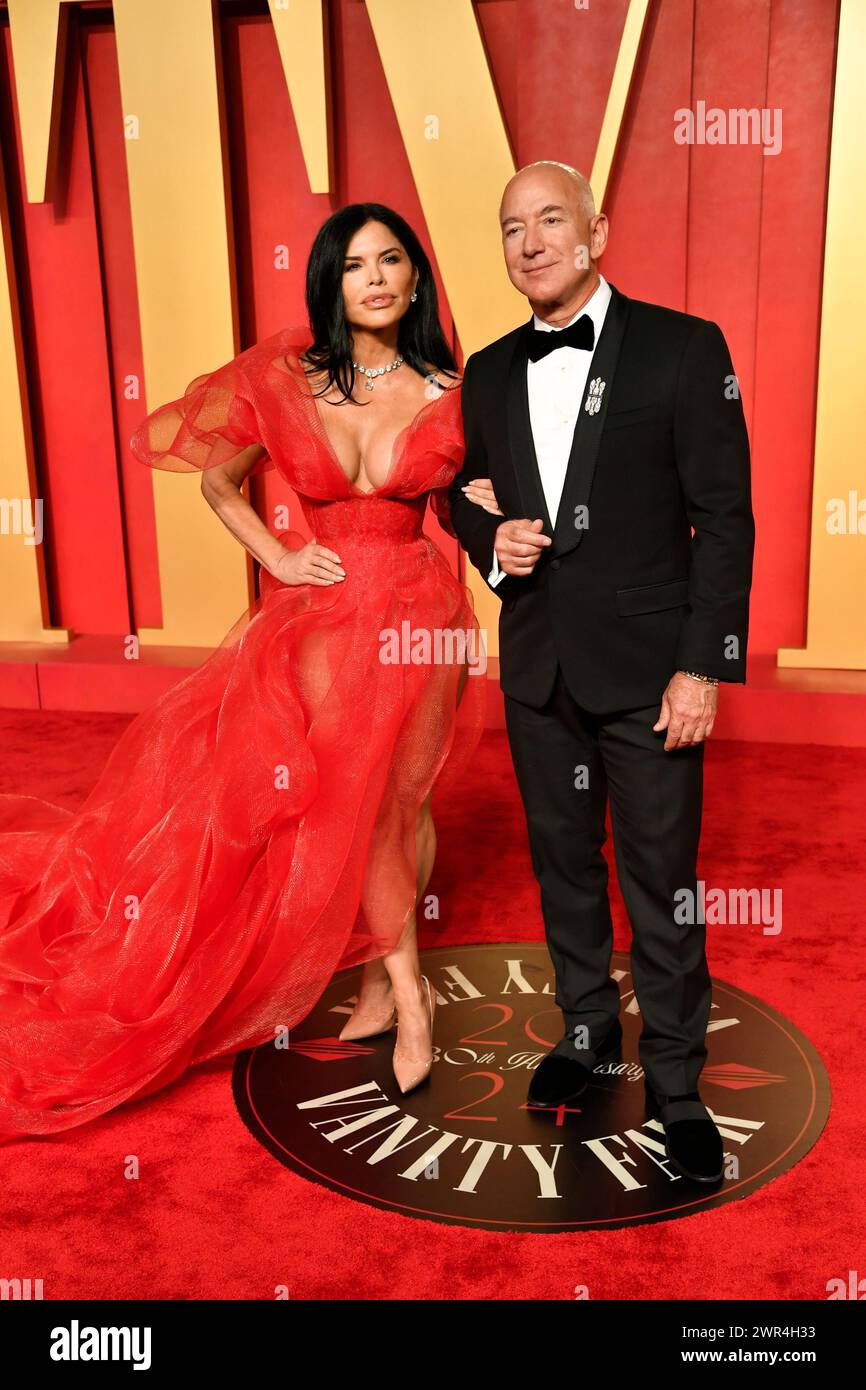 Lauren Sanchez, left, and Jeff Bezos arrive at the Vanity Fair Oscar Party on Sunday, March 10 ...