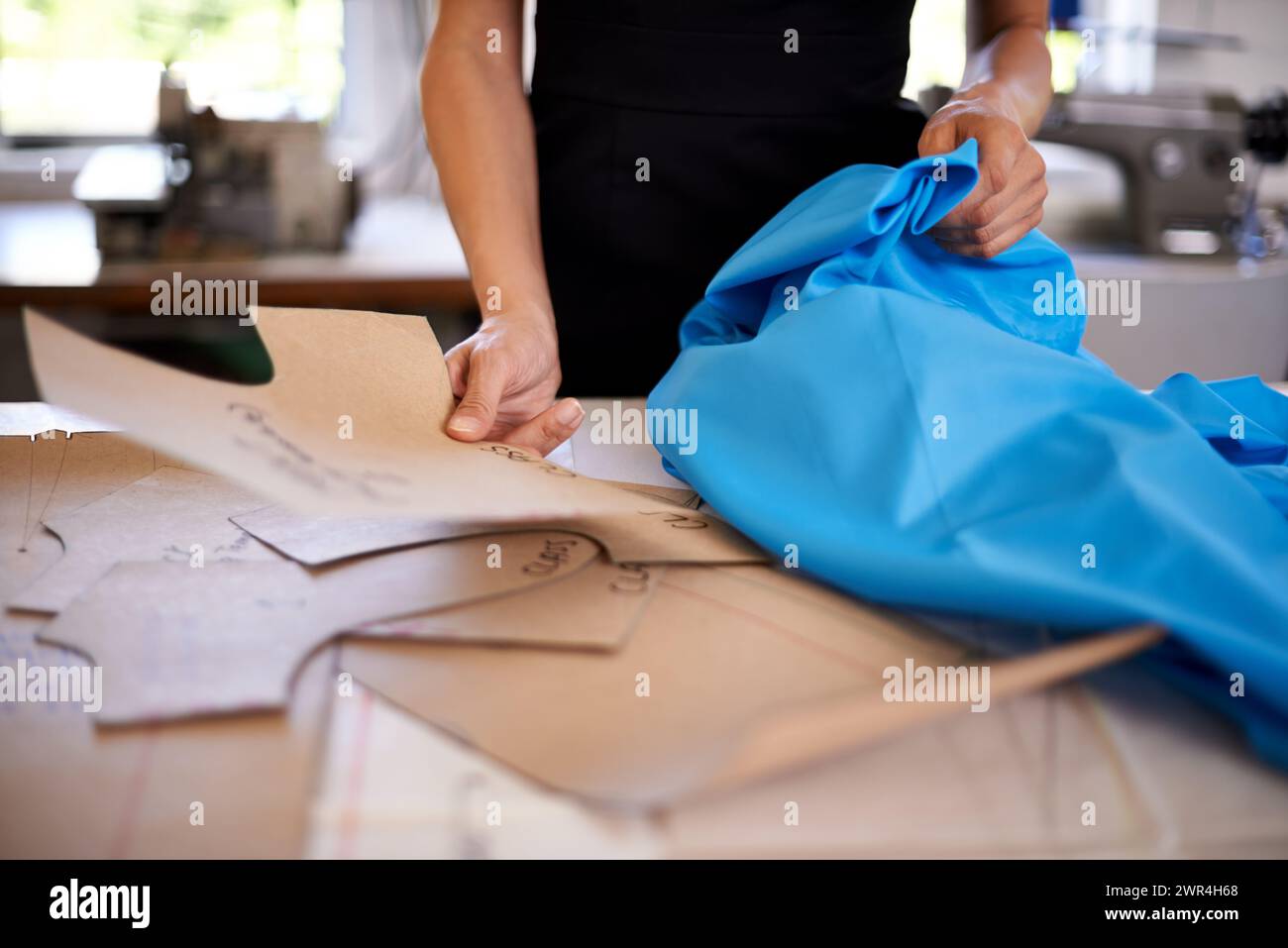 Fashion designer, patterns and fabric for clothes production, planning ...