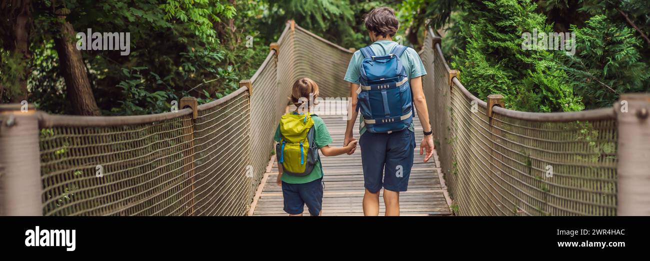 father and son tourists in Rope bridge in Yildiz Park. Besiktas ...