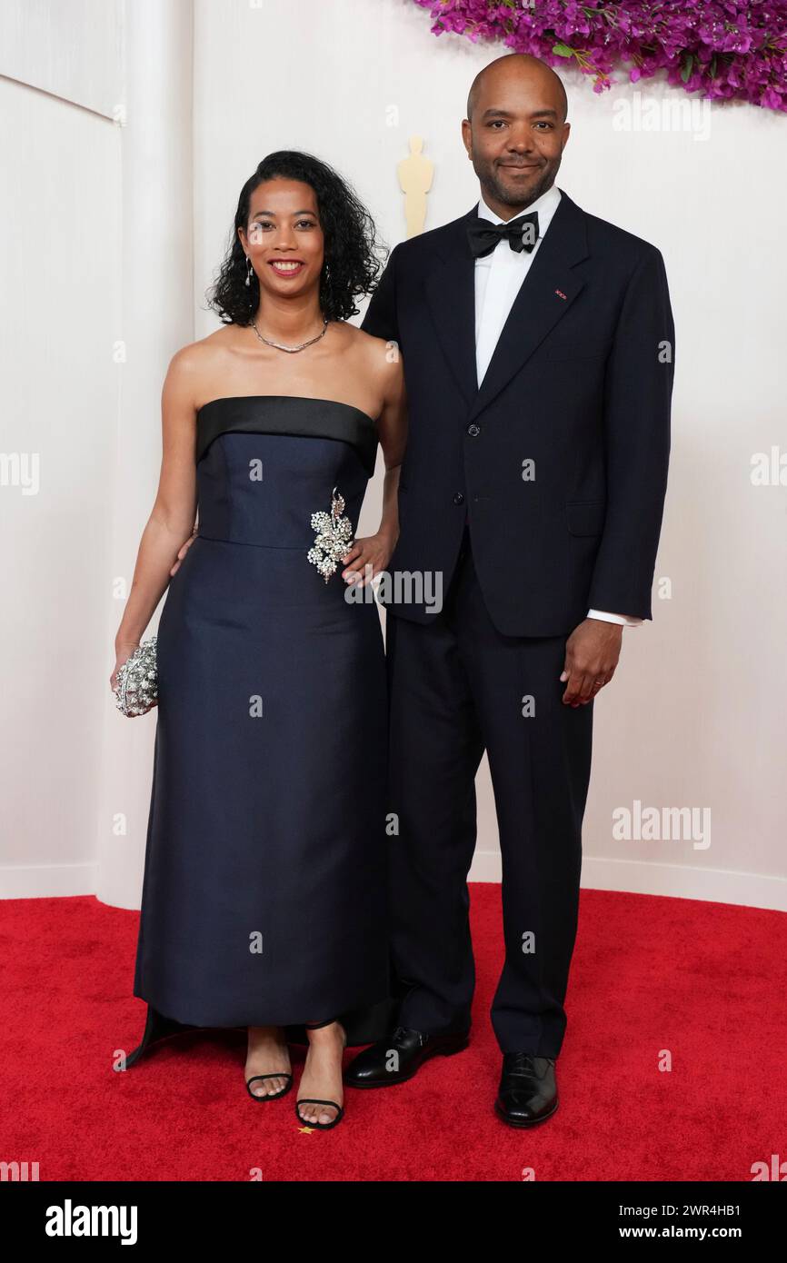 Christine Turner, left, and Scott Sasso arrive at the Oscars on Sunday ...