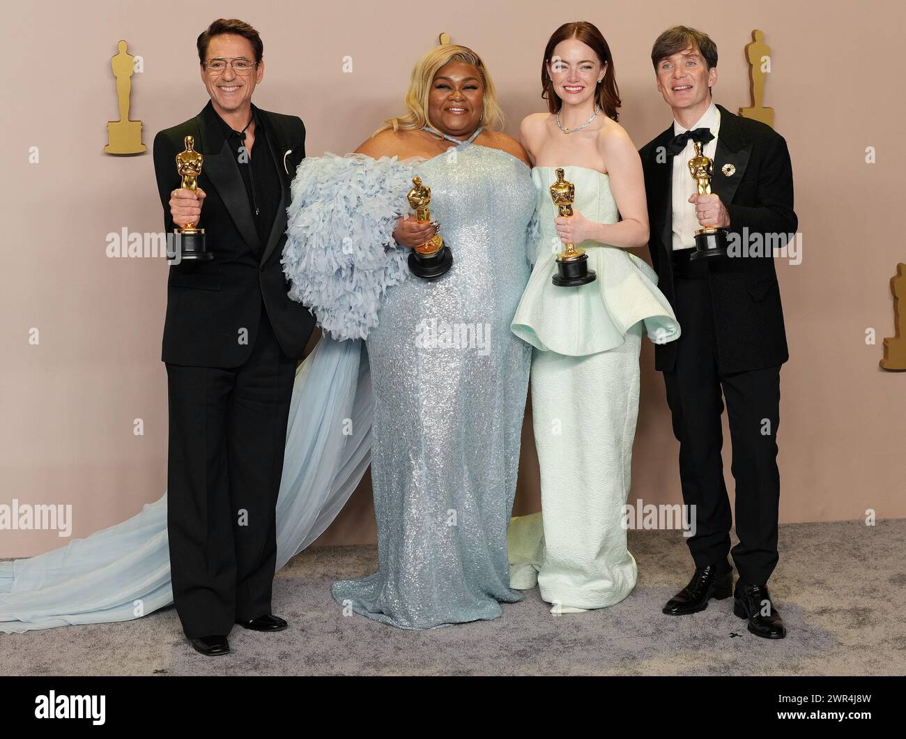 (L-R) Robert Downey Jr., winner of the Best Supporting Actor award for ...