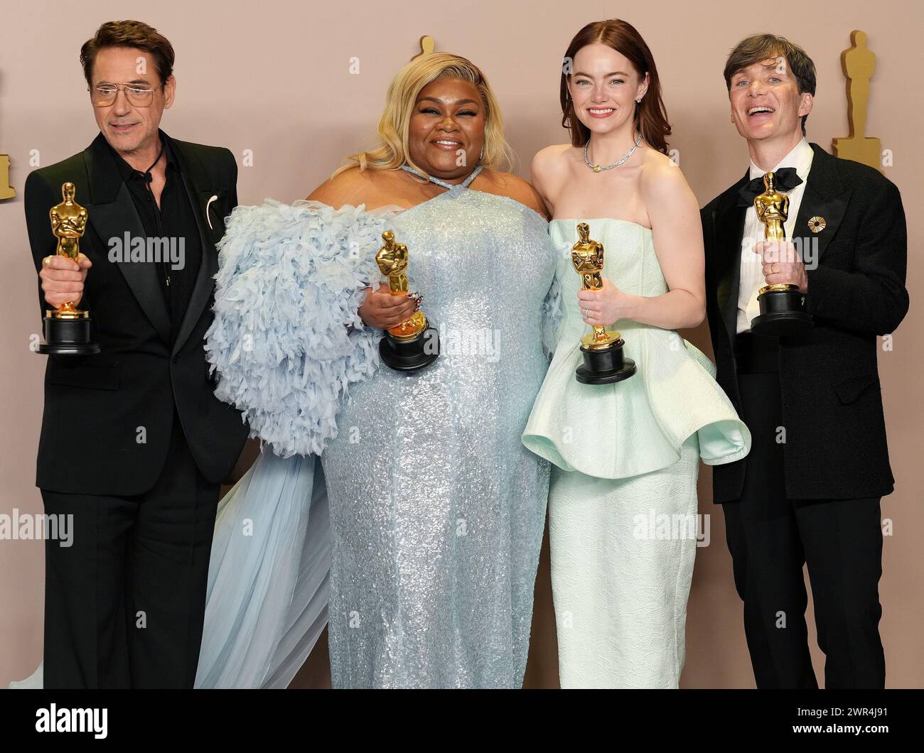 (L-R) Robert Downey Jr., winner of the Best Supporting Actor award for ...