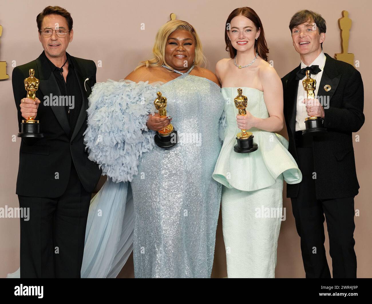 (L-R) Robert Downey Jr., winner of the Best Supporting Actor award for ...
