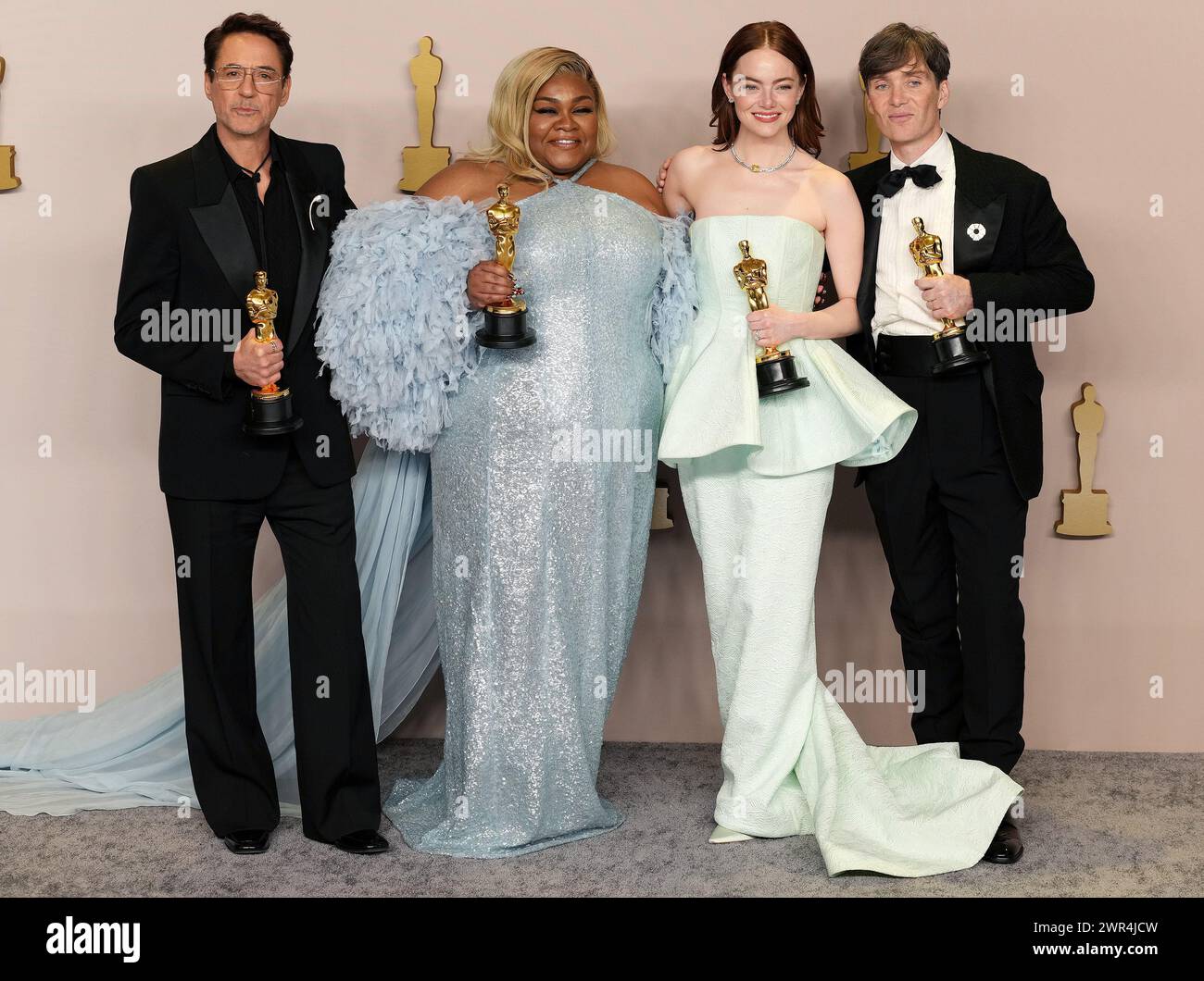 (L-R) Robert Downey Jr., winner of the Best Supporting Actor award for ...