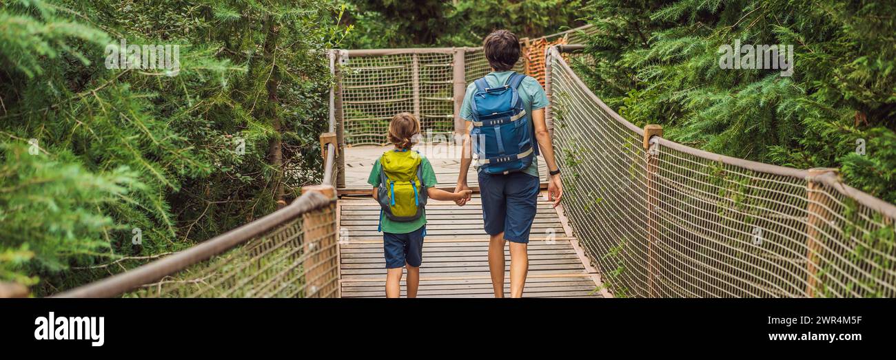 father and son tourists in Rope bridge in Yildiz Park. Besiktas ...