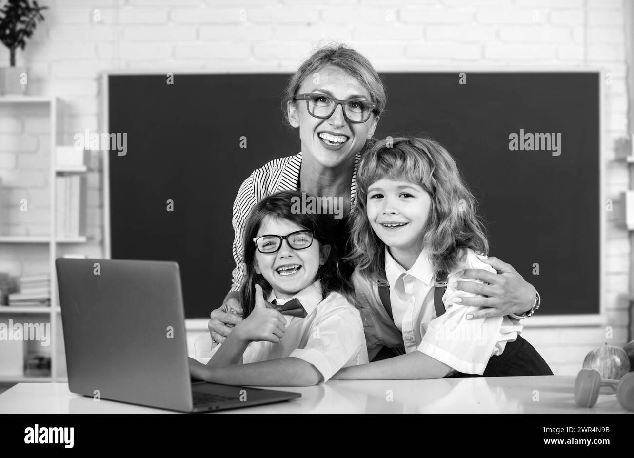 Back to school. Kids learning with teacher. Children from elementary ...