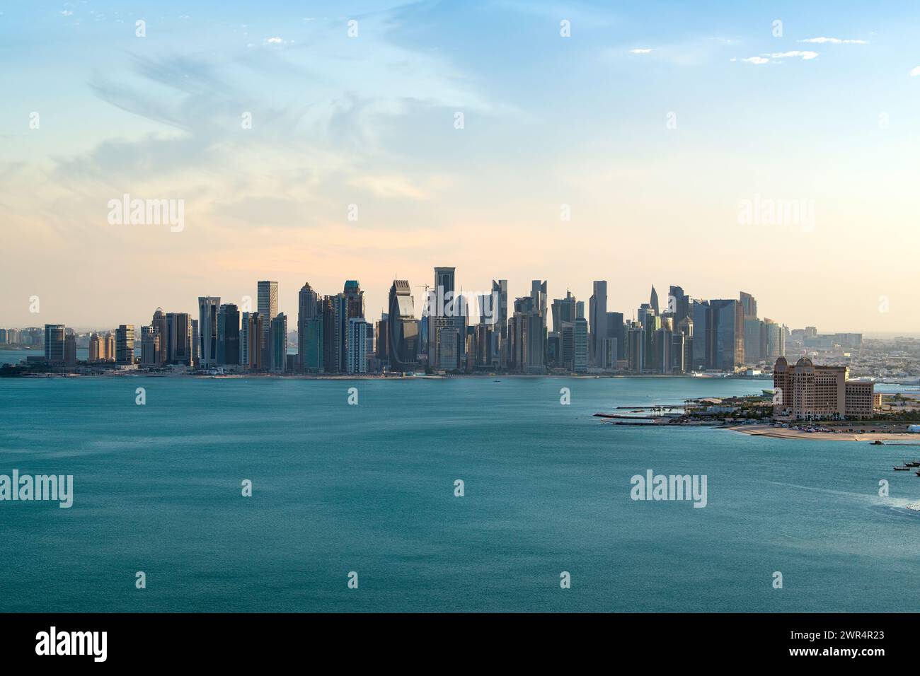 The skyline of Doha, Qatar during sunset Stock Photo - Alamy