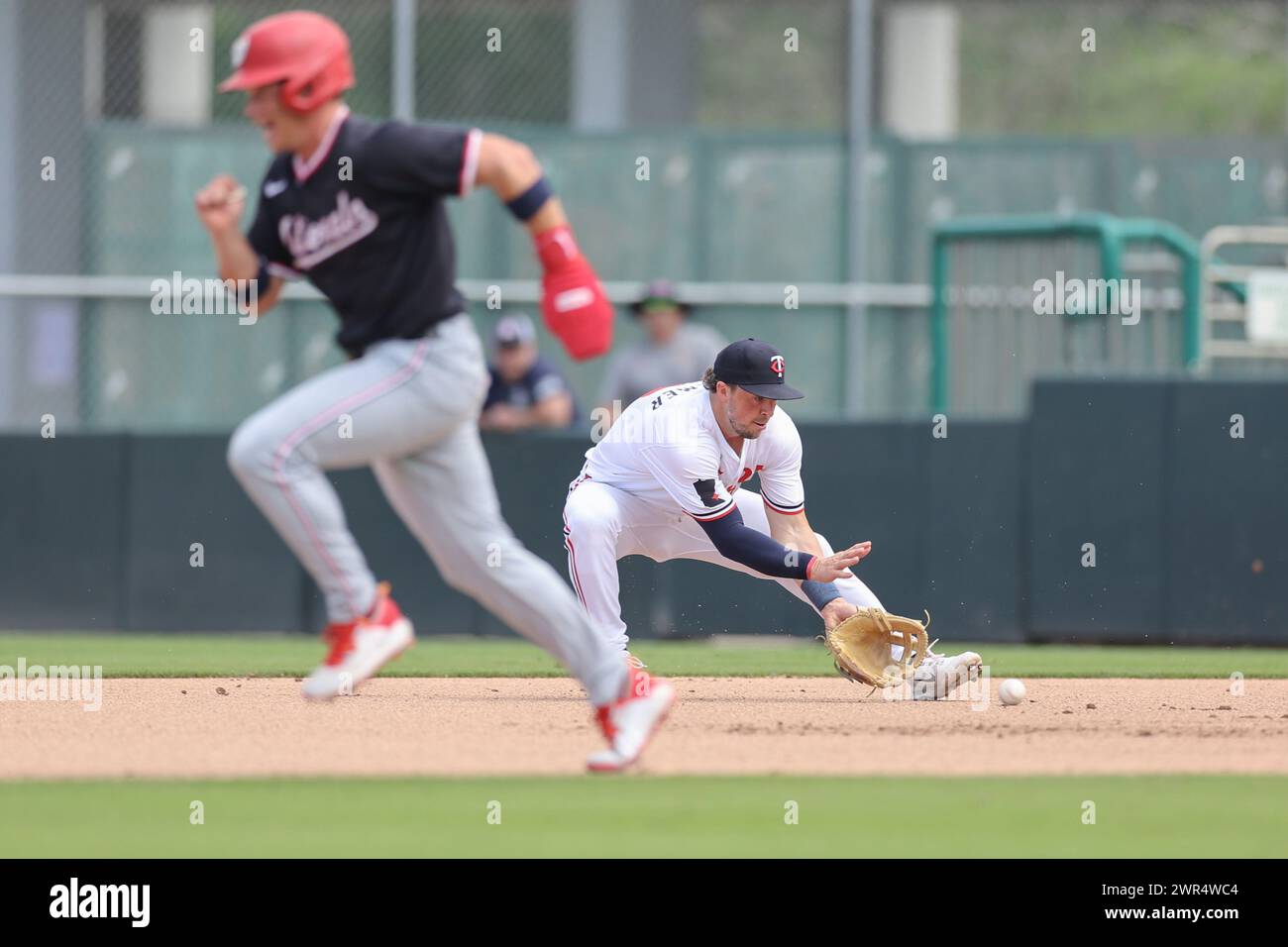 Fort Myers, FL: Minnesota Twins third baseman Kyle Farmer (12) fields a ...