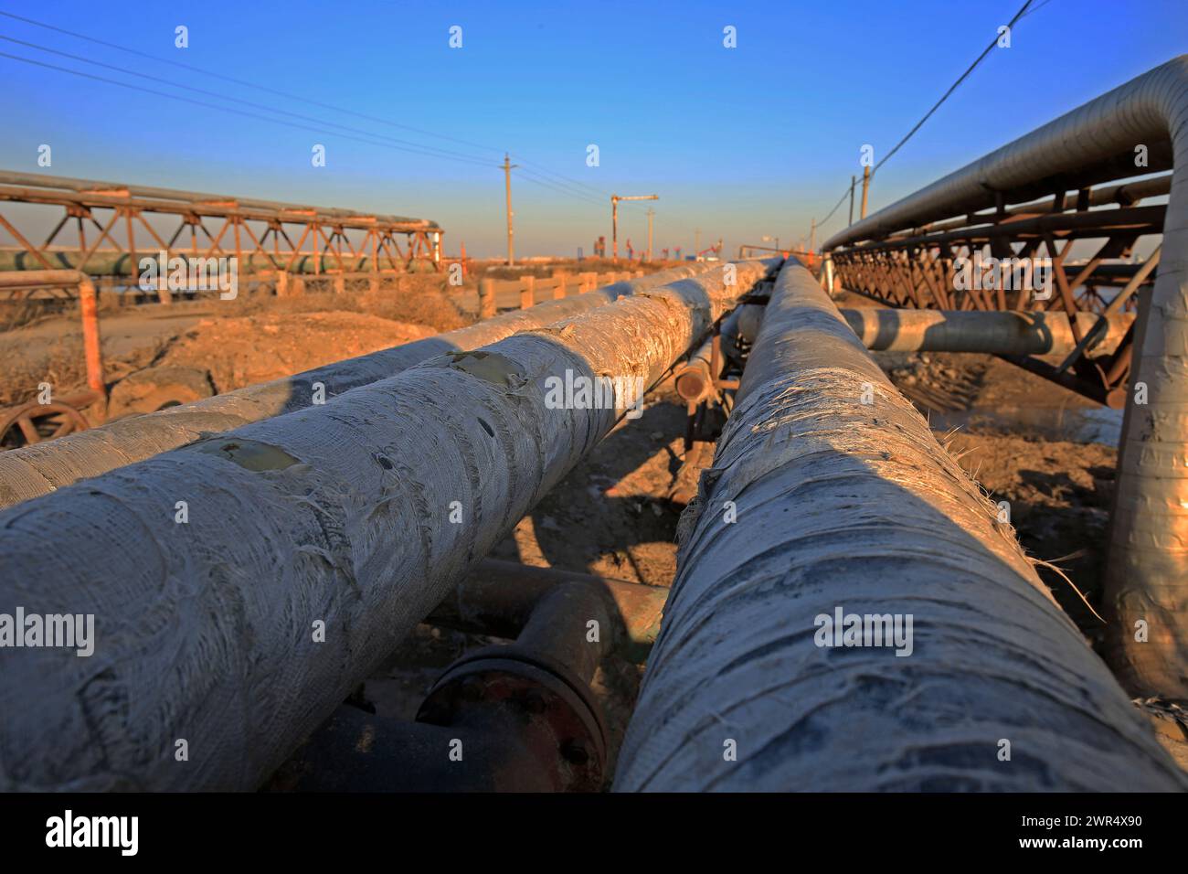 Oilfield equipment and pipeline Stock Photo - Alamy