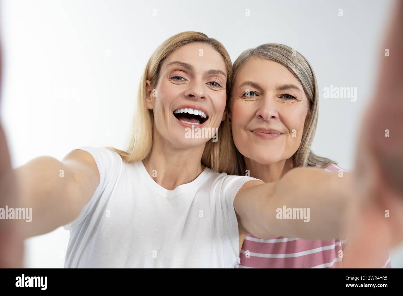 Mother and daughter having good time together and looking happy Stock ...