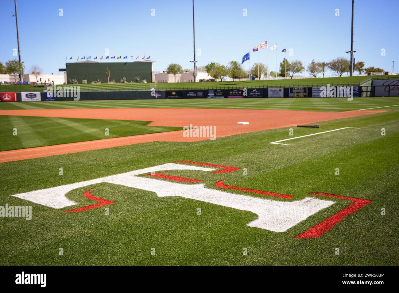 Texas Rangers logo sits before an MLB spring training baseball game ... Texas Rangers logo sits before an MLB spring training baseball game ...