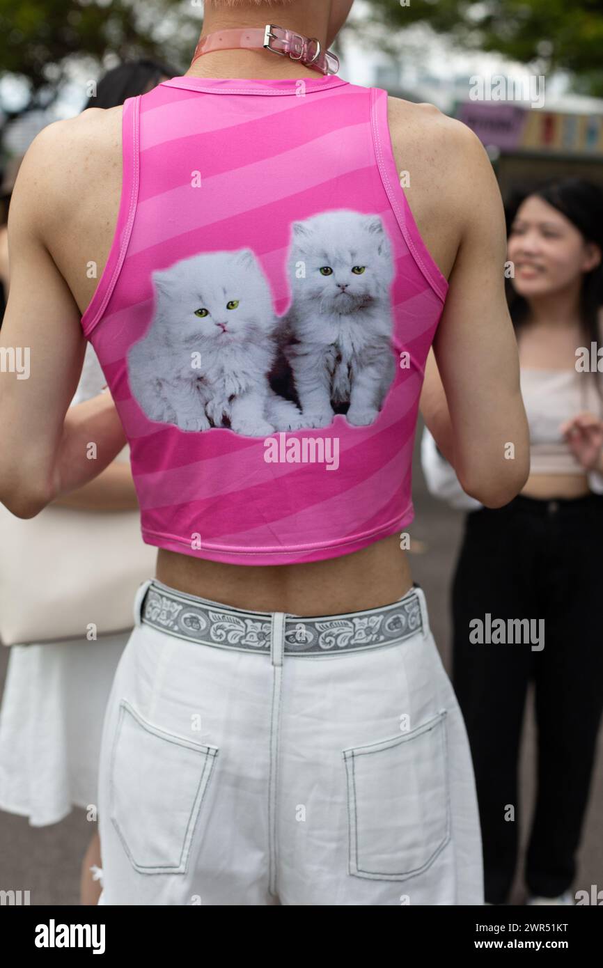9 March 2024, backview of a male fan wearing a pink vest with cat ...