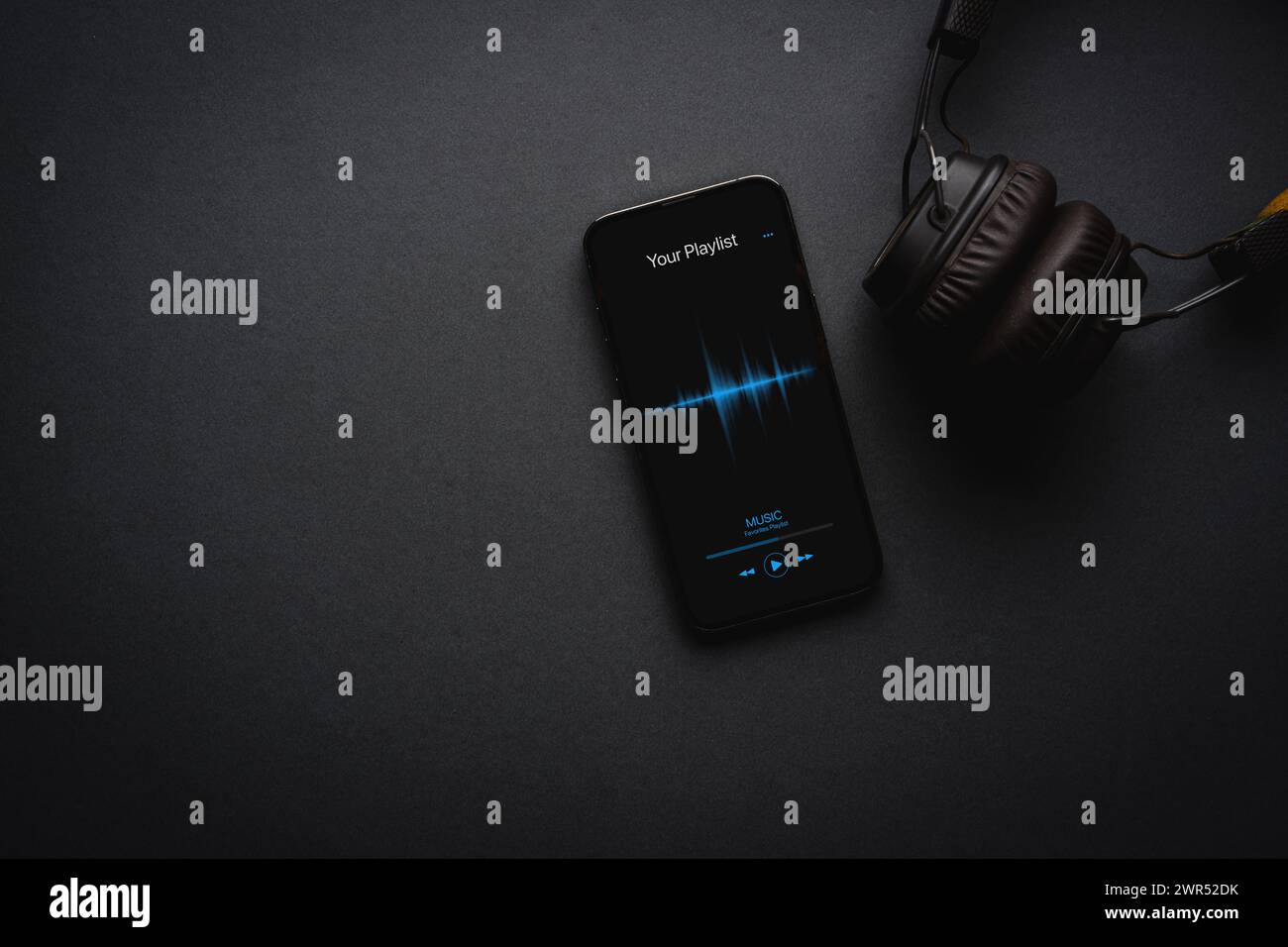 Smartphone with music player app on dark grey background Stock Photo ...