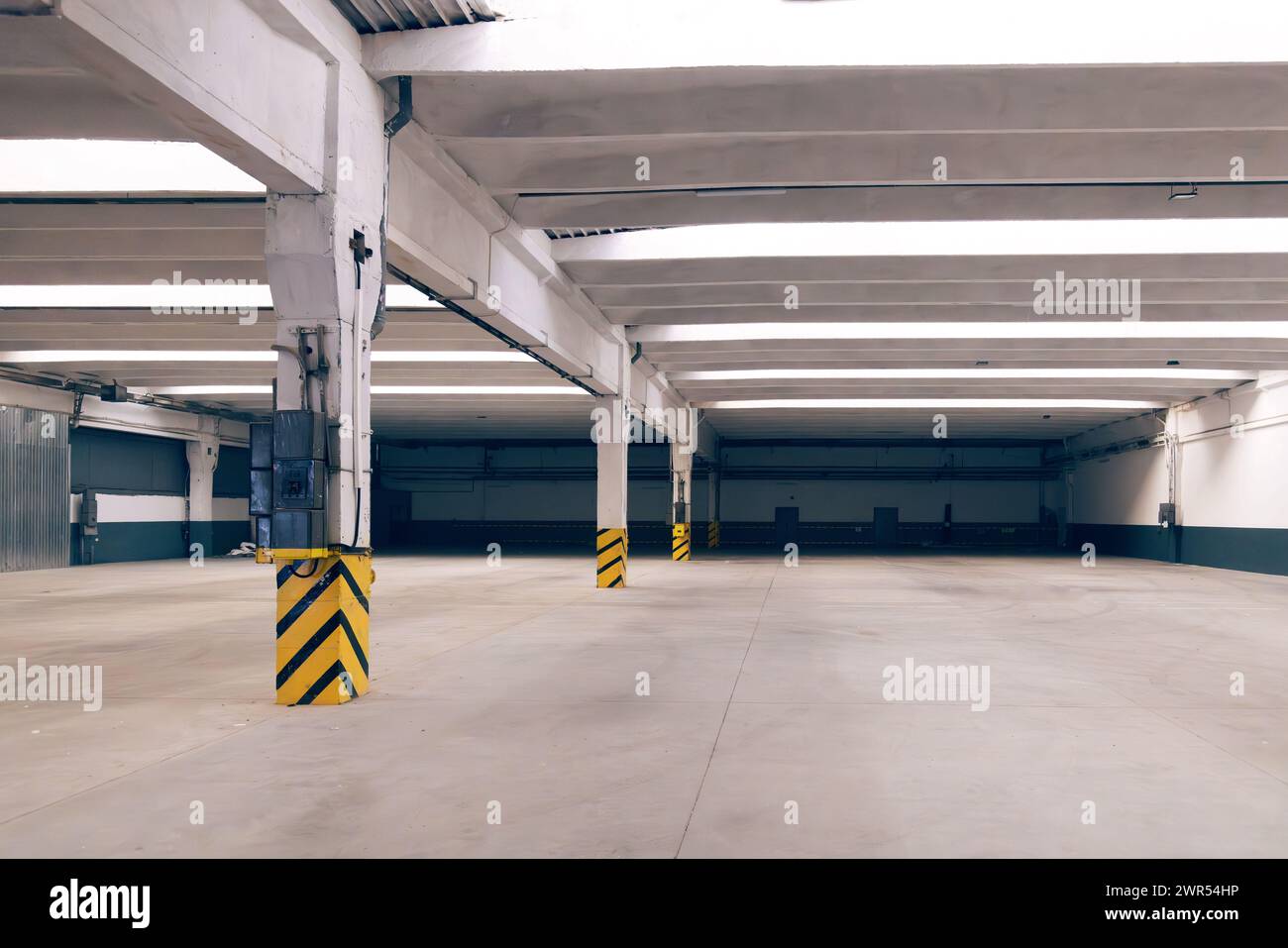 Interior of large empty storehouse. Industrial building. Several ...
