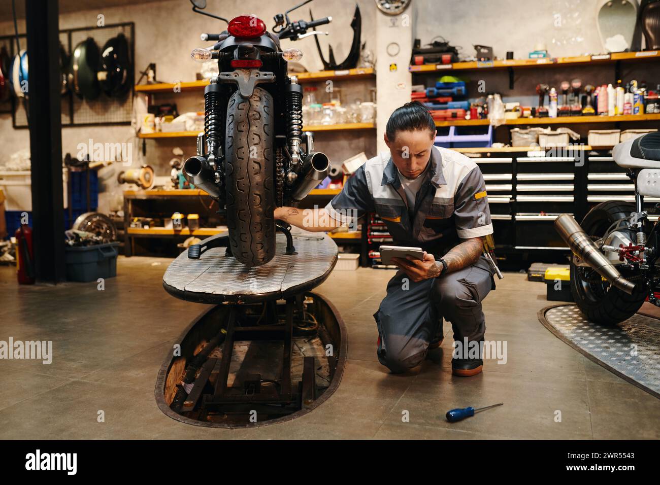 Repairman examining broken screen hi-res stock photography and images ...