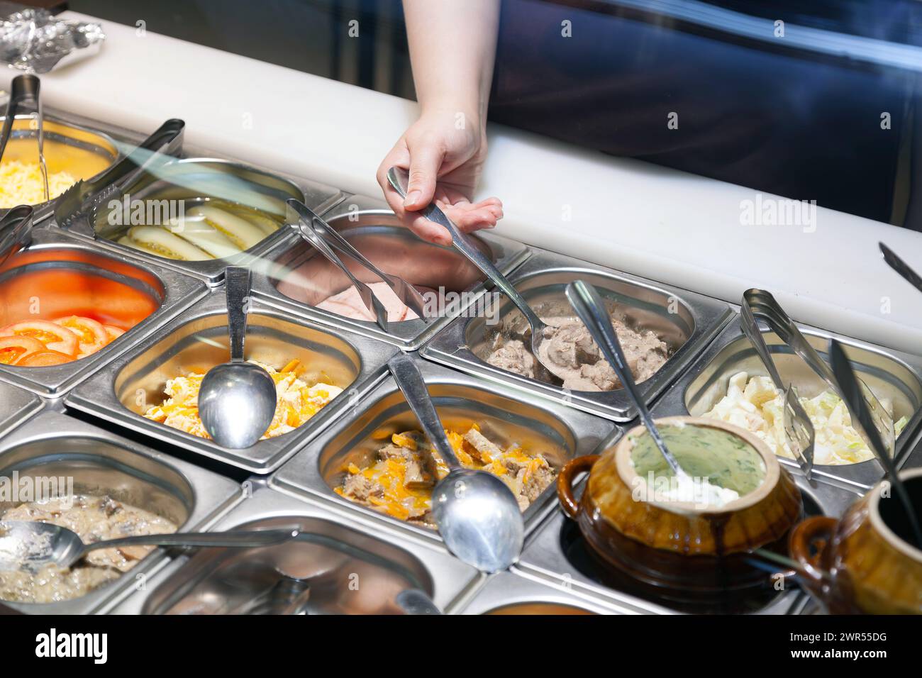 Breakfast buffet in hotel woman hi-res stock photography and images - Alamy