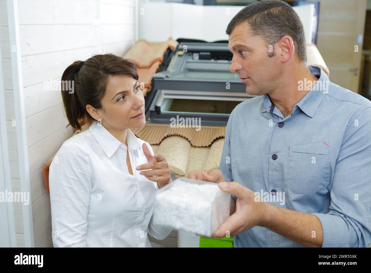 store manager with warehouseman checking goods reception Stock Photo ...