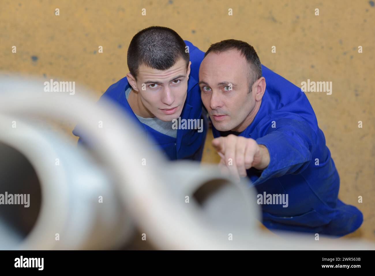 Portrait two men fixing hi-res stock photography and images - Alamy