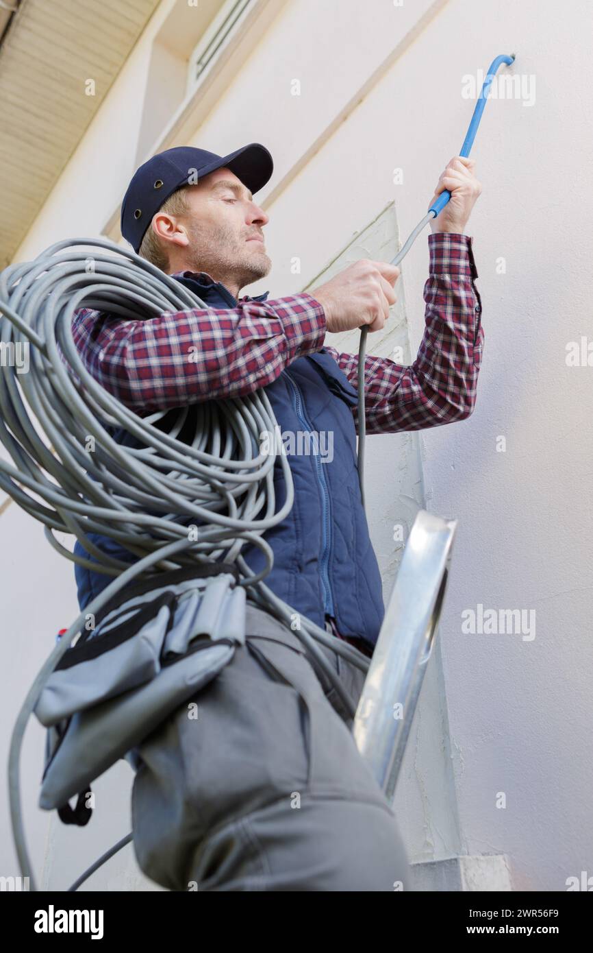 electric cable in metal pipes indoor Stock Photo - Alamy