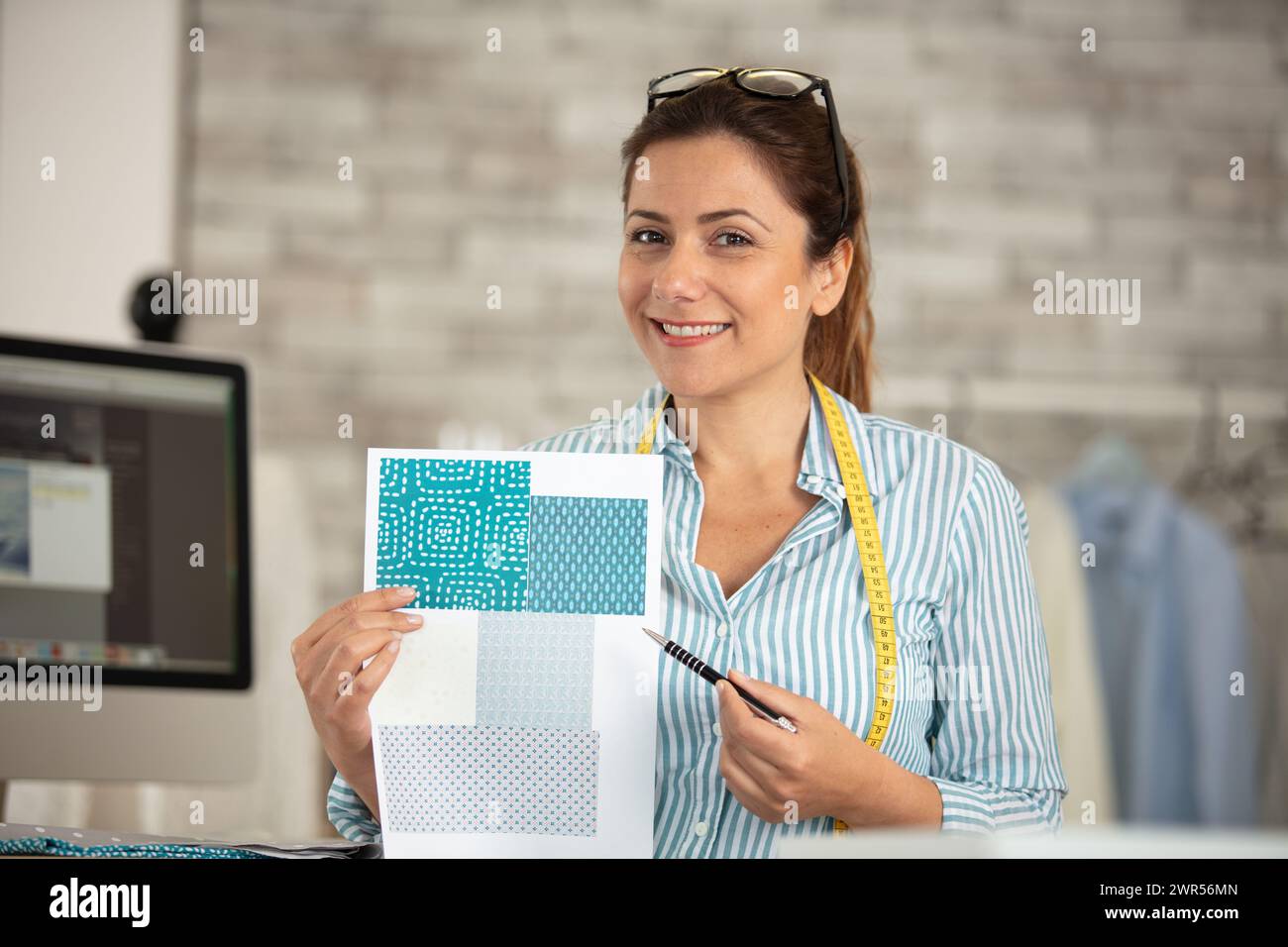 female designer showing design swatches Stock Photo - Alamy
