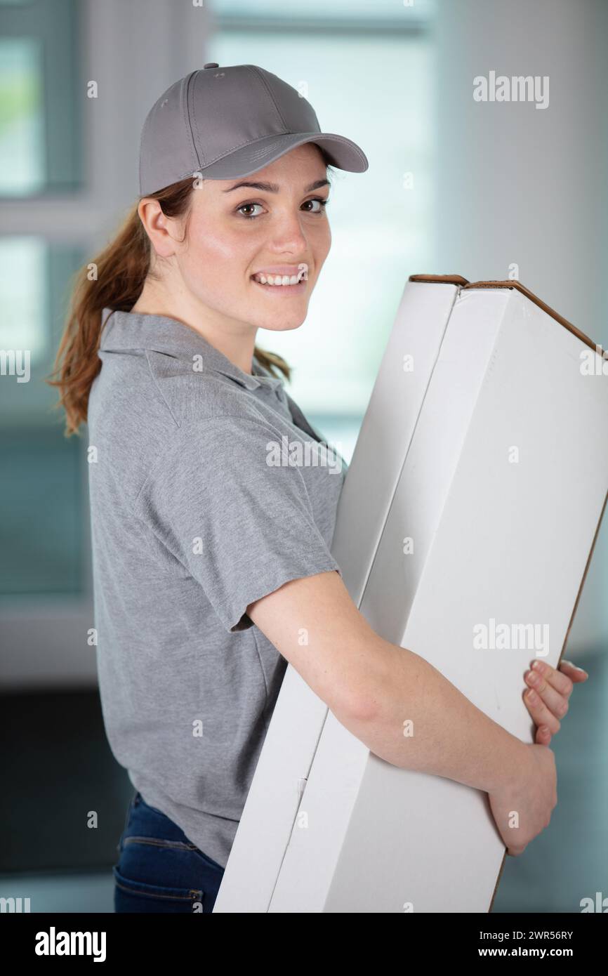 Woman is painfully carrying boxes hi-res stock photography and images - Alamy