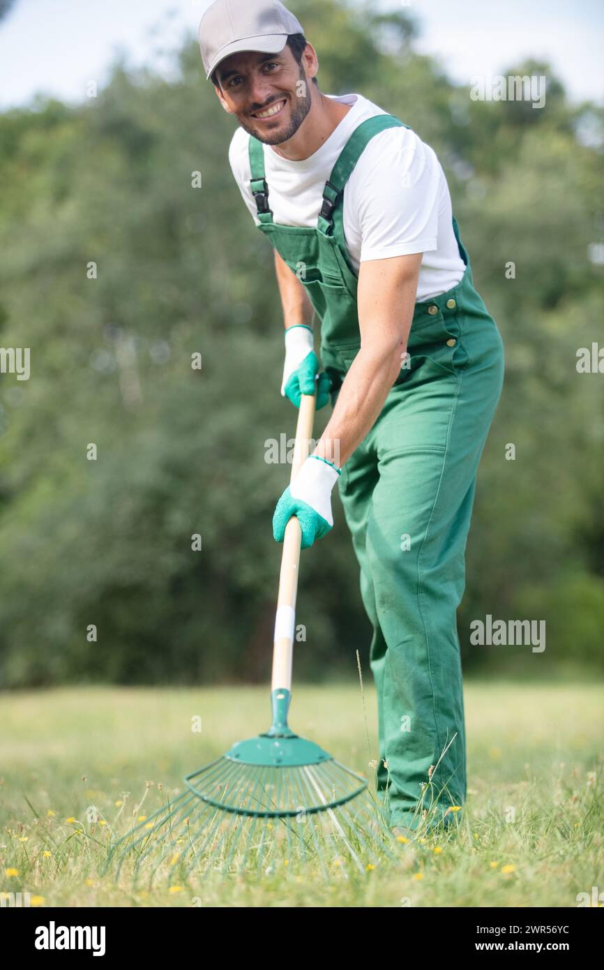 Man standing in grass rake hi-res stock photography and images - Alamy