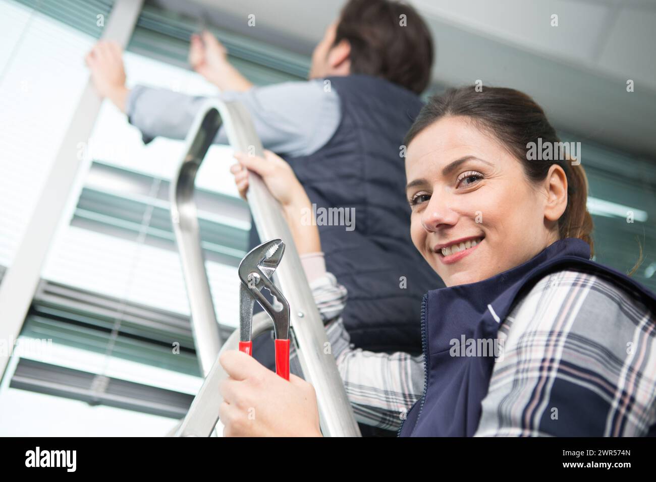 Helping colleague hi-res stock photography and images - Alamy