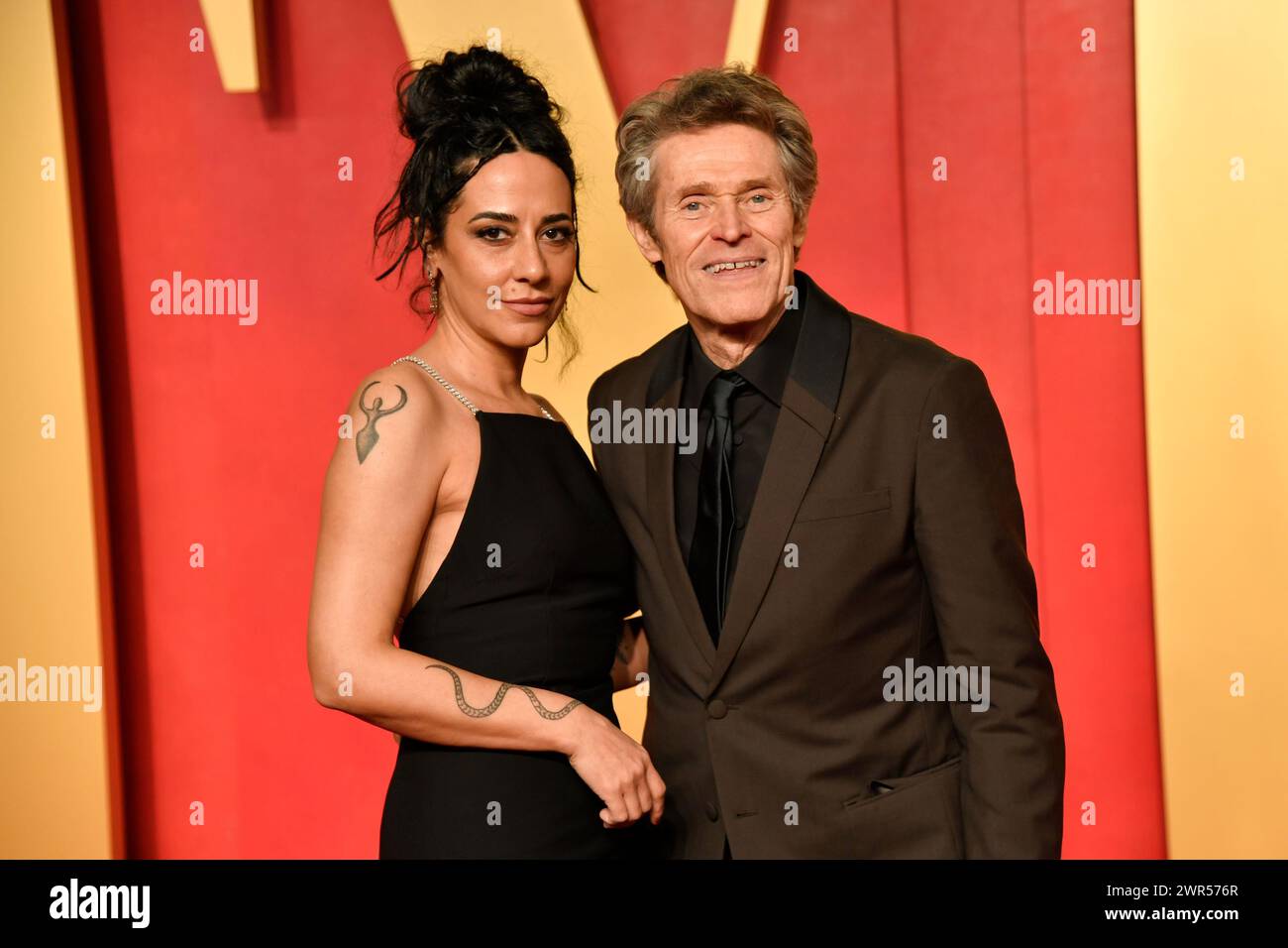 Giada Colagrande, left, and Willem Dafoe arrive at the Vanity Fair ...