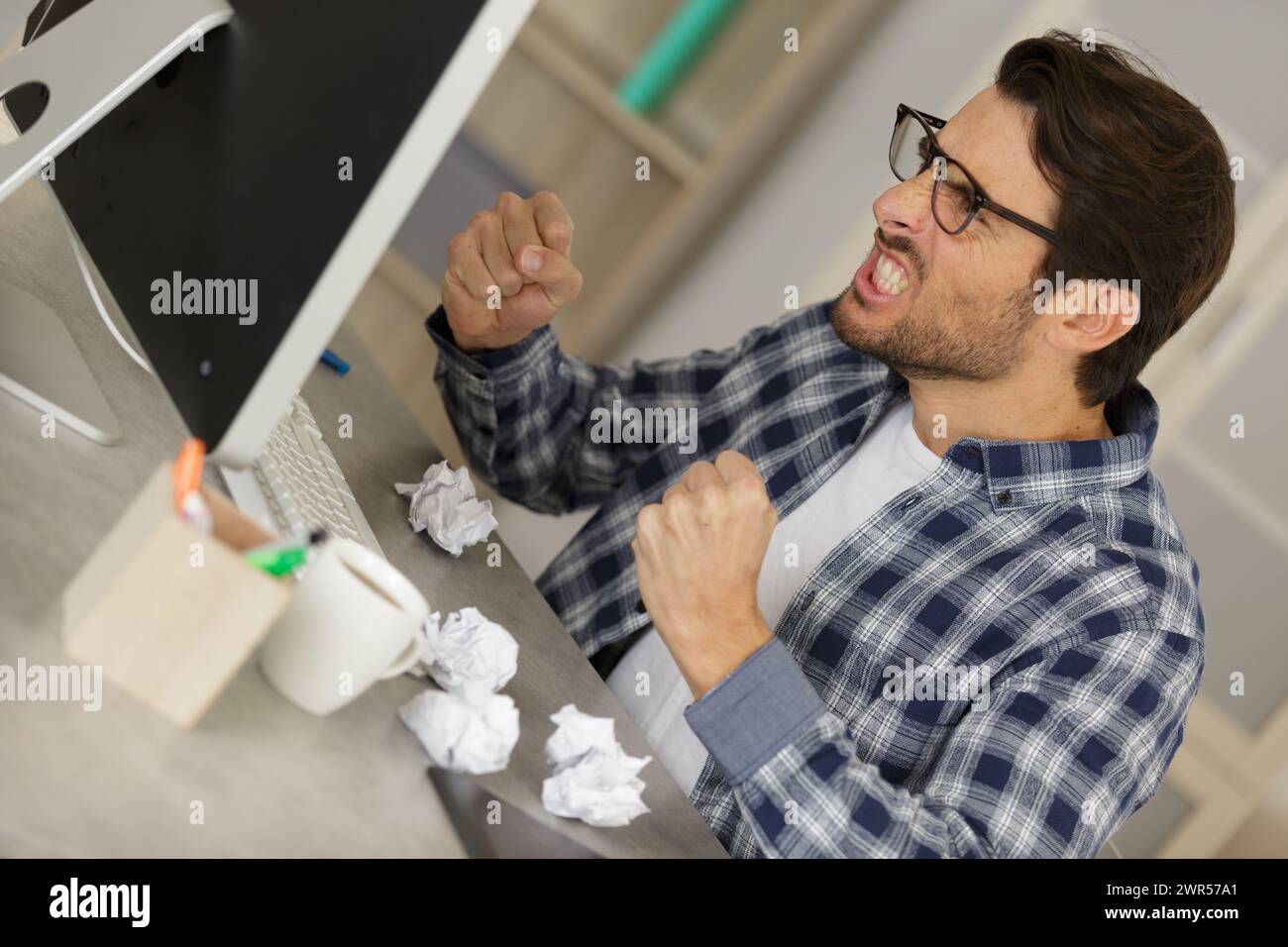 wrinkled paper in the hands of an aggressive man Stock Photo - Alamy