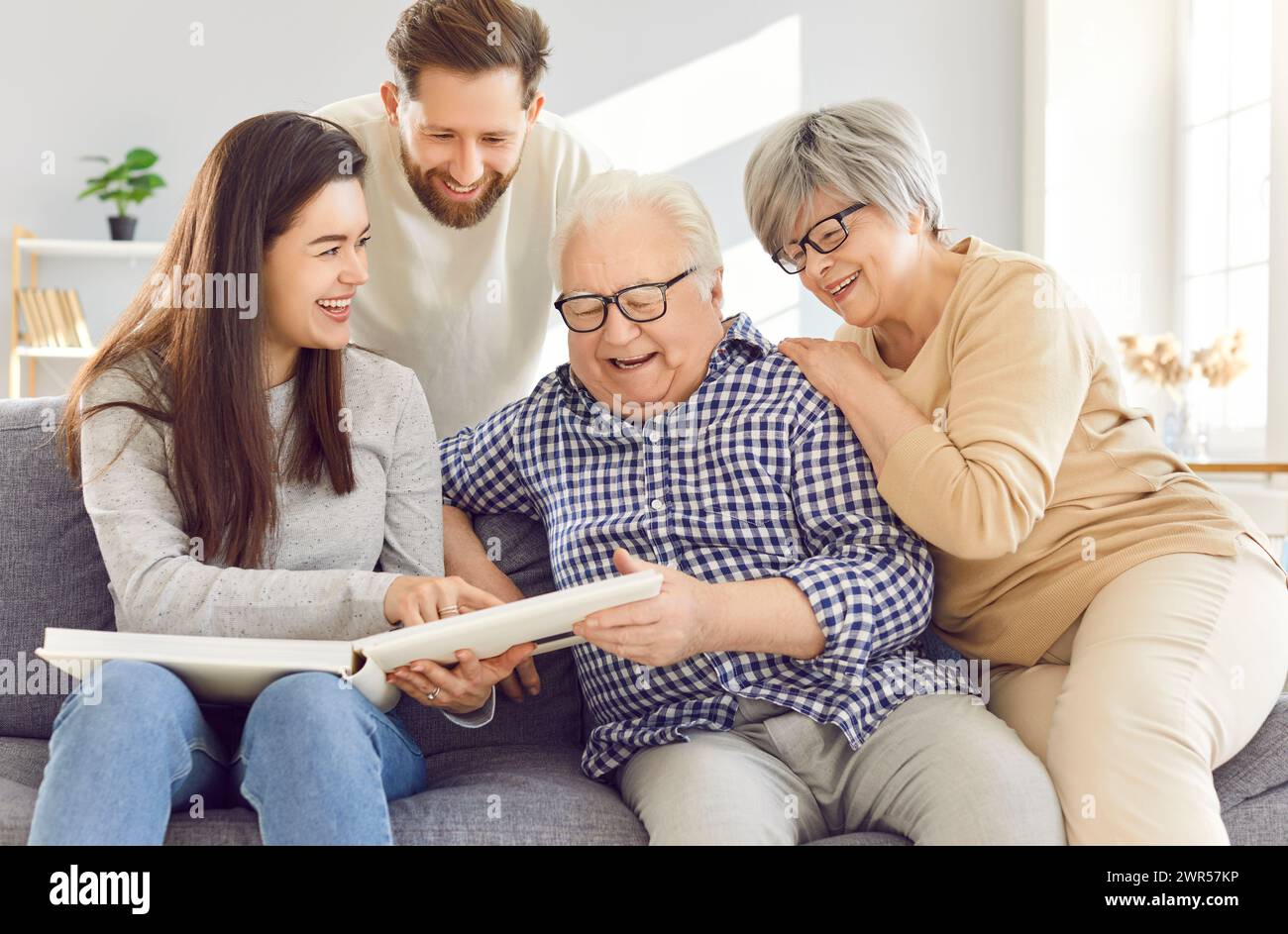 Mother son looking photo album hi-res stock photography and images - Alamy