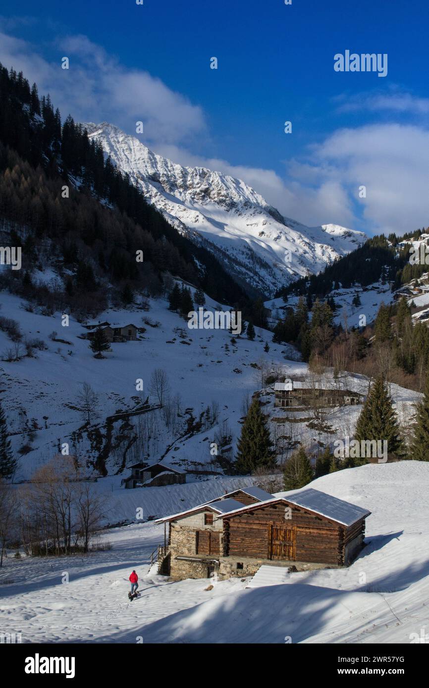 winter landscape in the mountains with mountain lodge. Snow capped ...