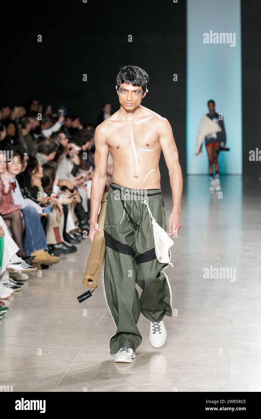 A model walks the runway at the DuarteHajime show during the Lisbon ...