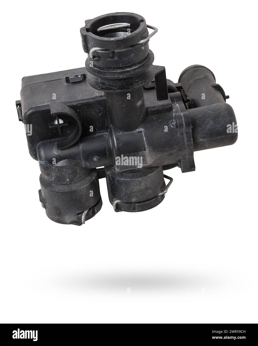 Heating system valve made of black plastic on a white isolated ...