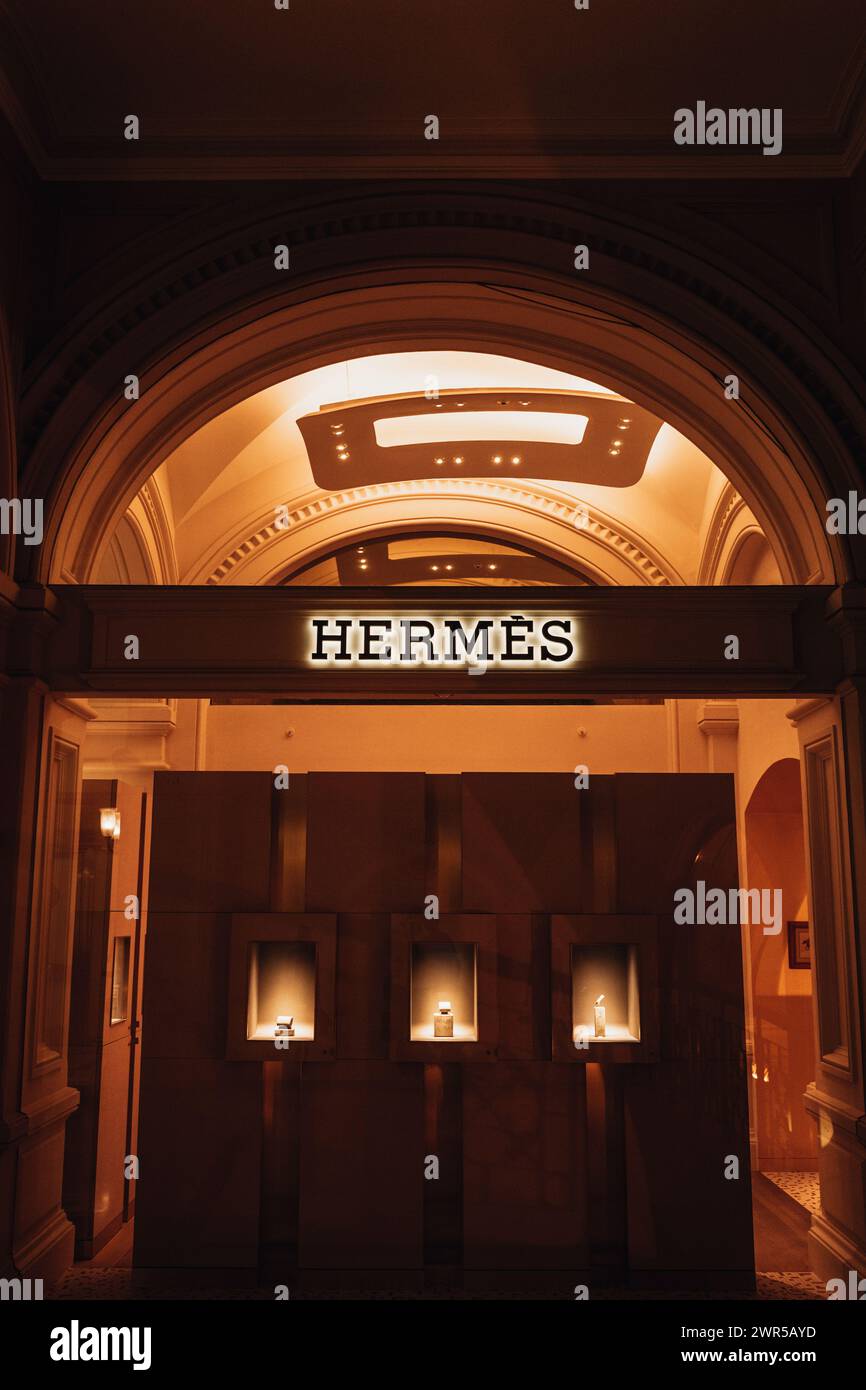 Golden facade interior of a famous Hermes store in a shopping mall ...