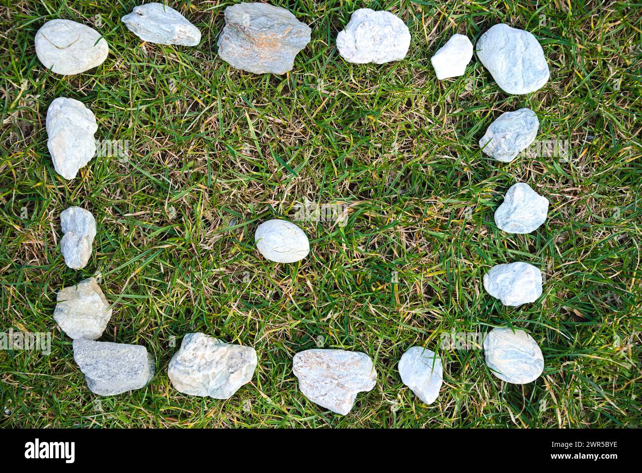 Rectangular Frame Of Patterned Stones With Stone Egg In The Center In ...