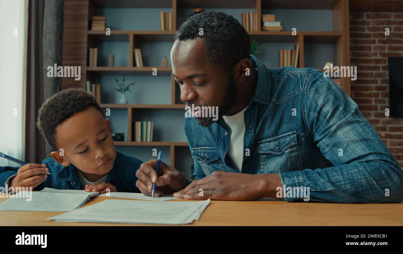 African American happy family little boy child schoolboy with father ...